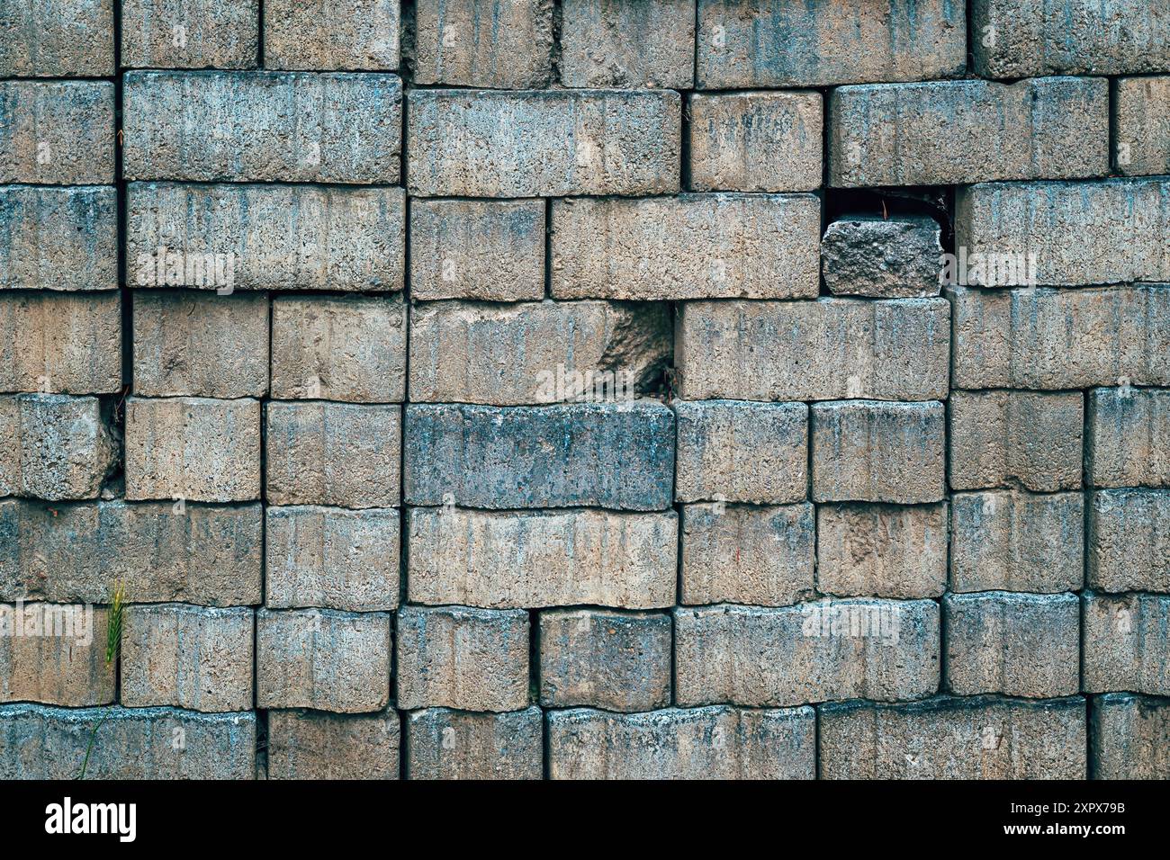 Concrete paving blocks stacked on construction site, background and ...