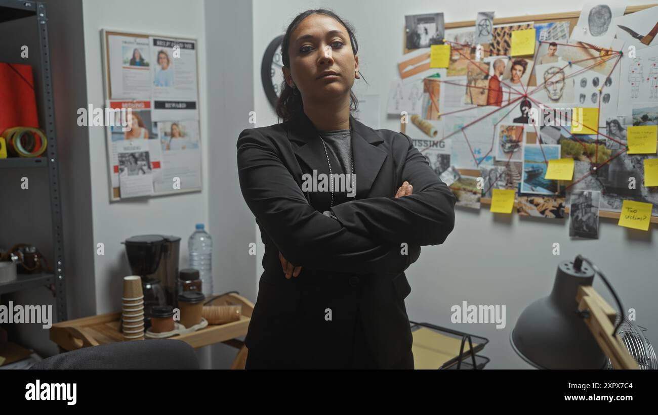 Confident hispanic woman detective standing in a cluttered police ...