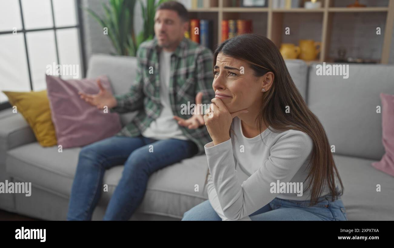 A distressed woman crying and a man gesturing in a disagreement at a ...