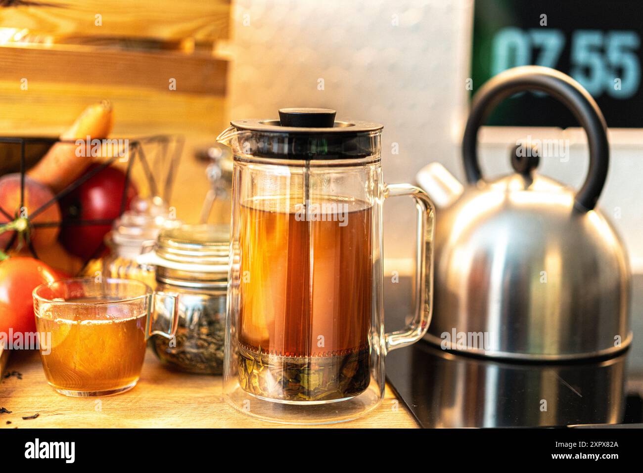 tea kettle with piston. Kitchen interior table. Spices jars, hot drink ...