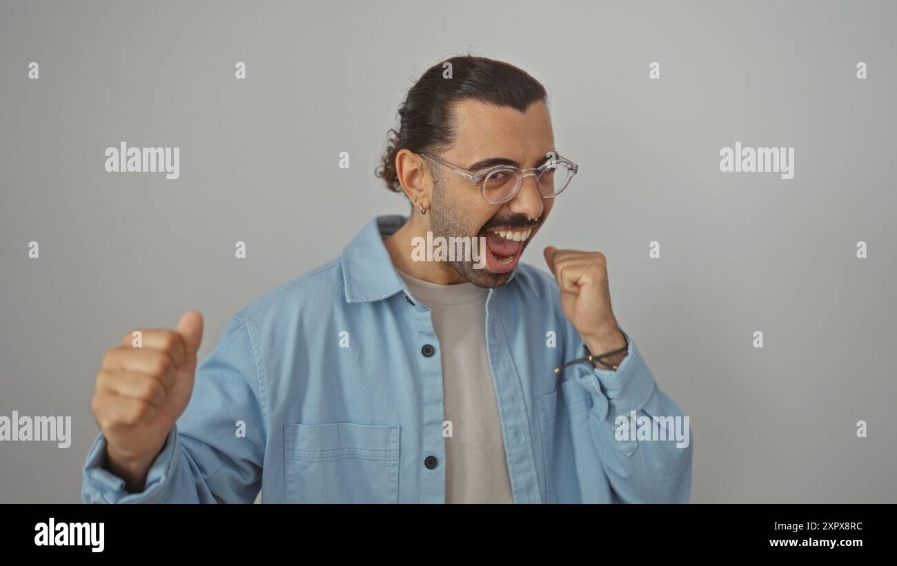 Young hispanic man with moustache celebrating over an isolated white ...