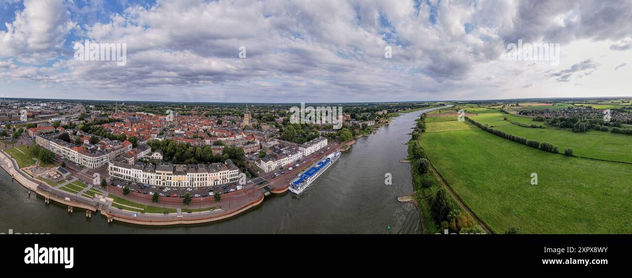 Hanseatic medieval tower town Zutphen seen from across the river IJssel ...
