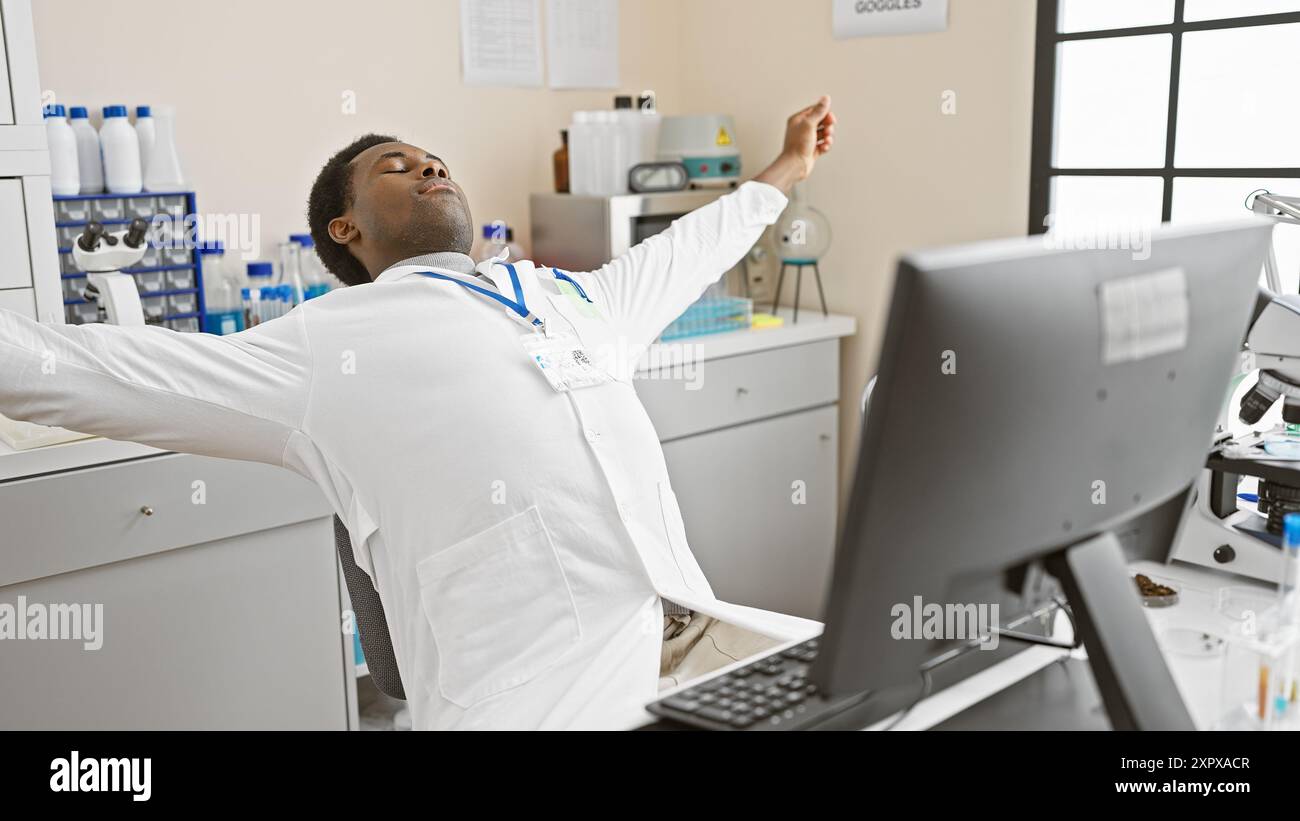 African man stretching in a modern laboratory setting, surrounded by ...