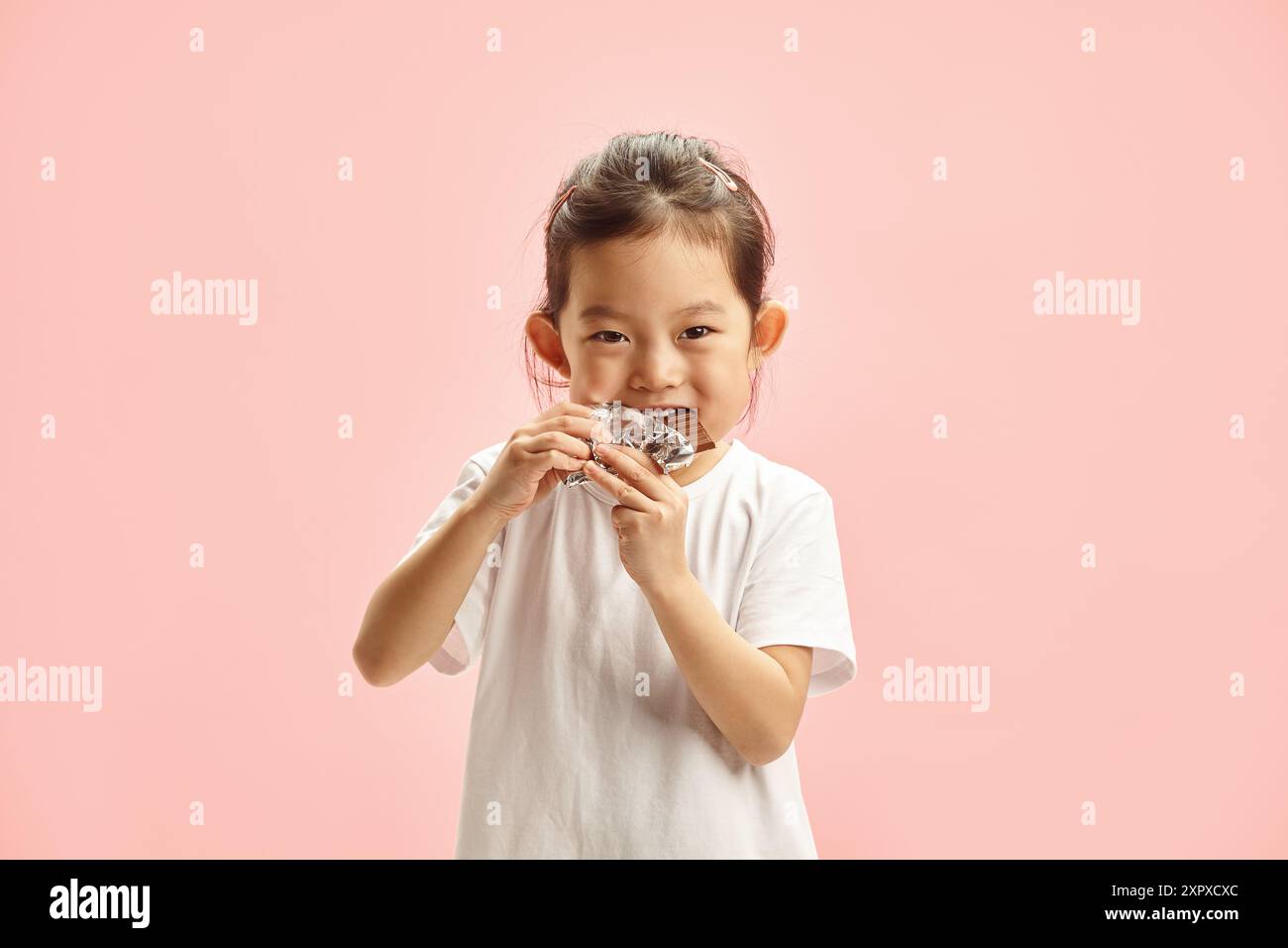 Portrait of Sweet Child Girl in White t Shirt Biting Greedily Chocolate ...