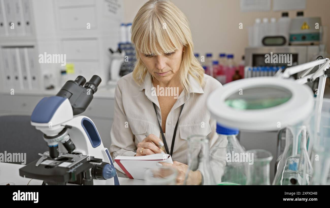 Scientific researcher taking experiment notes hi-res stock photography ...