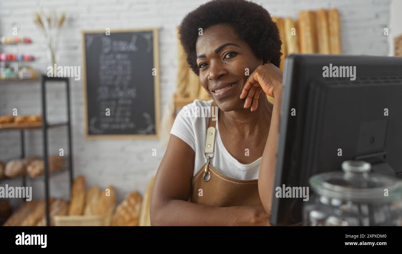 Professional afro american female baker hi-res stock photography and images - Alamy