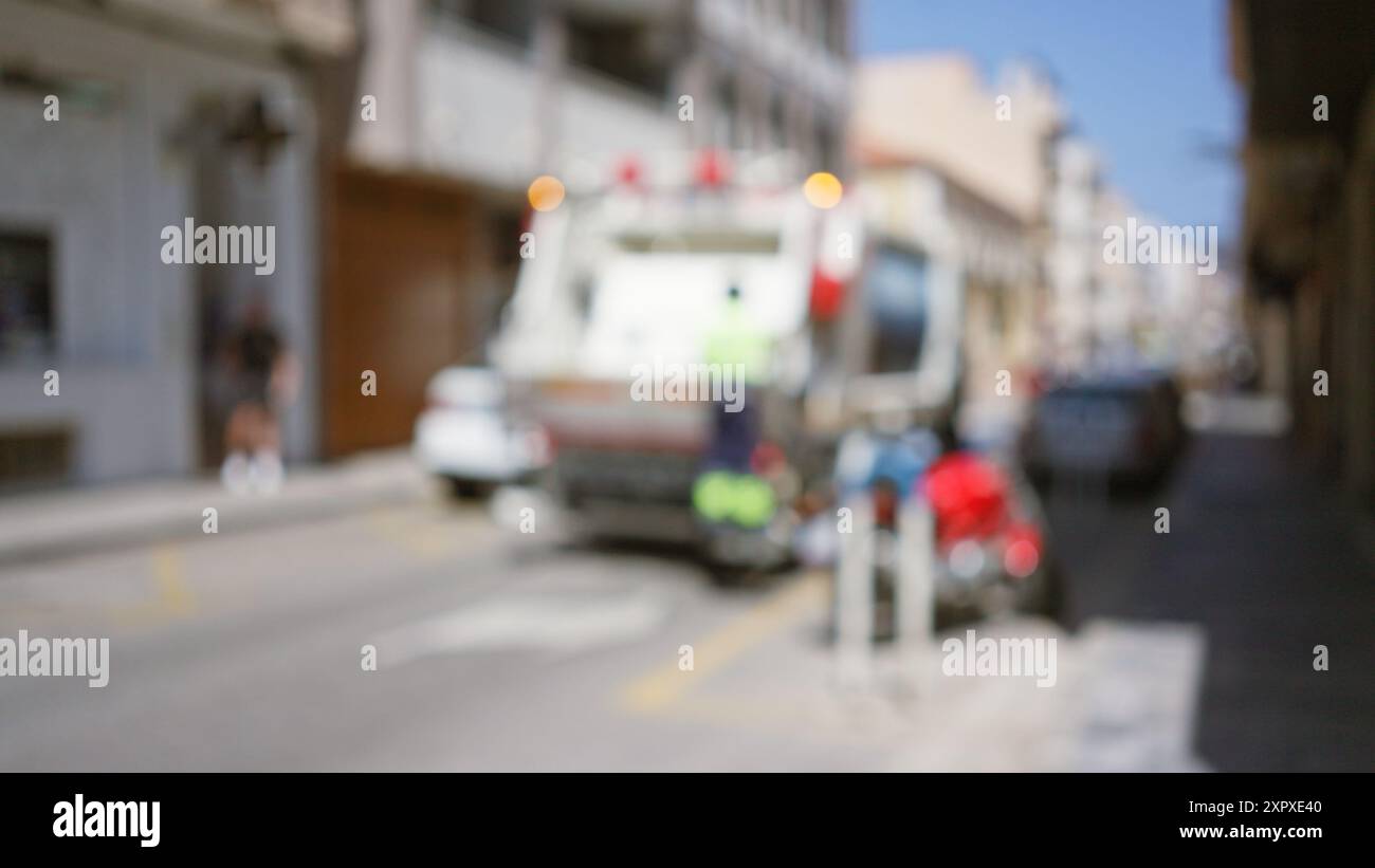 Blurred image of a street scene with cars and people creating a dreamy ...