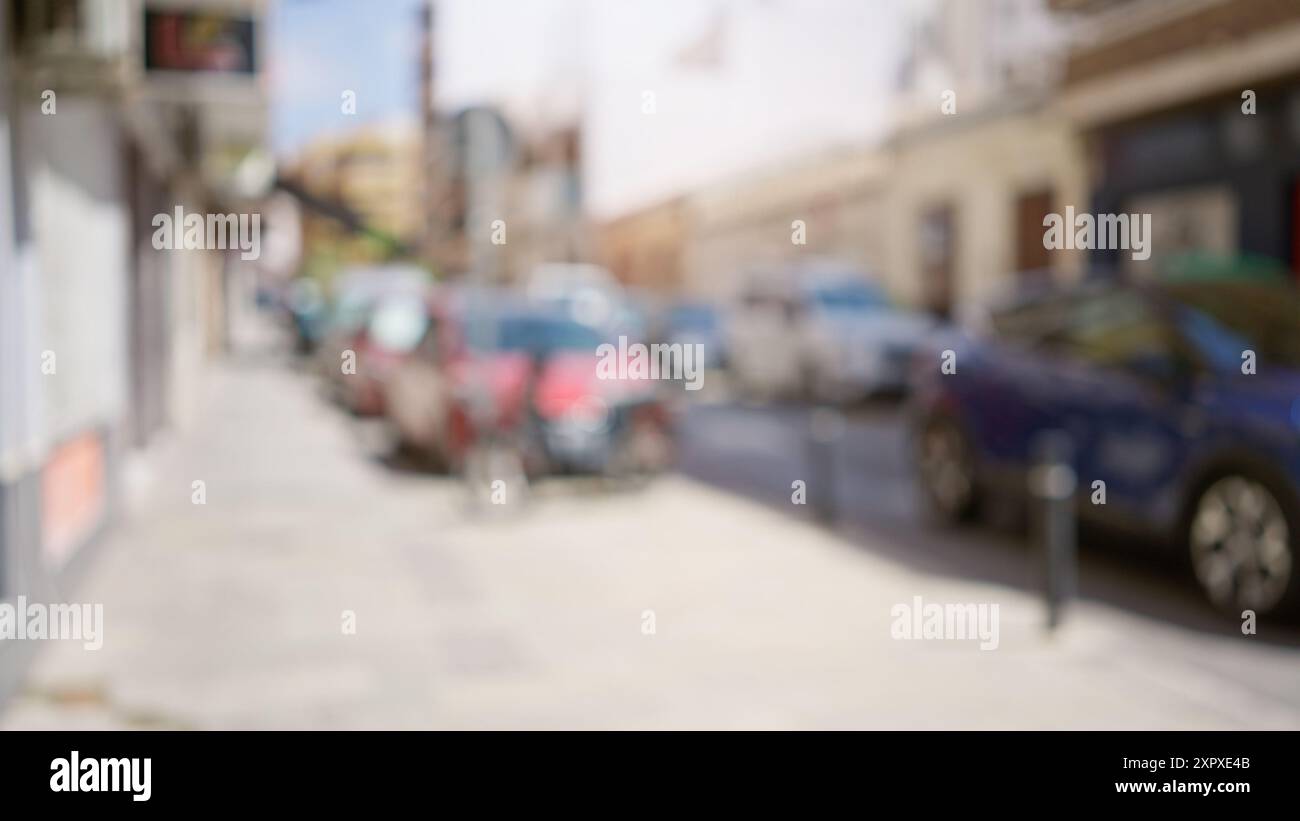 Blurred background of an outdoor city street with out of focus cars ...