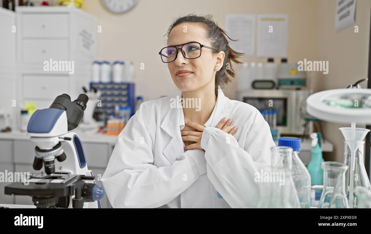 Young hispanic woman in labcoat hi-res stock photography and images - Alamy