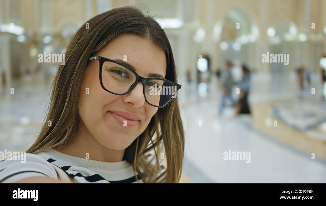 A young brunette woman poses indoors at the presidential qasr al watan ...