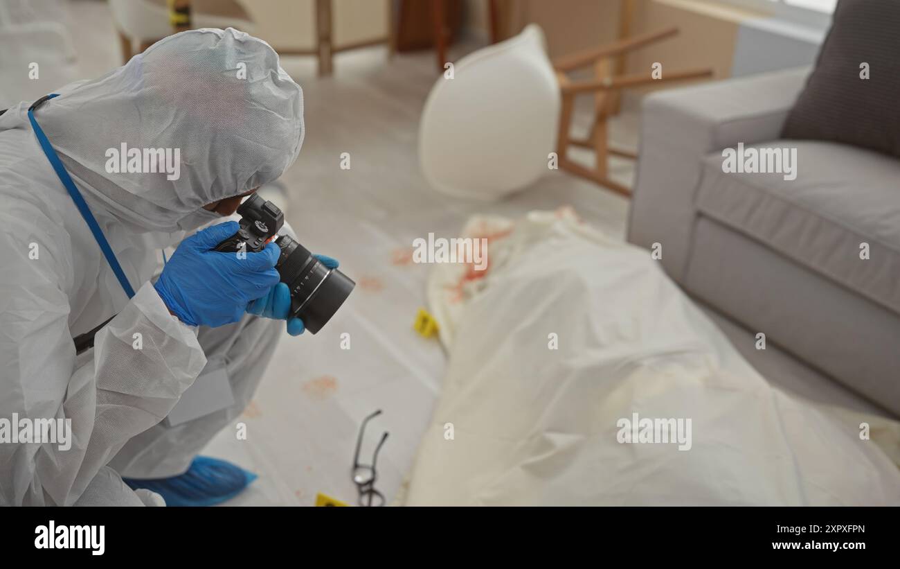 A man in a hazmat suit photographs evidence at a detailed indoor crime ...