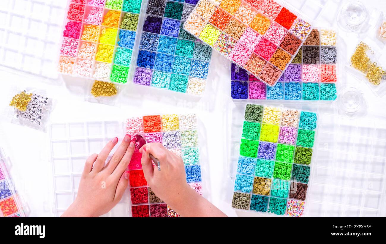 Woman's Hands Amidst a Rainbow Array of Beads for Jewelry Crafting ...