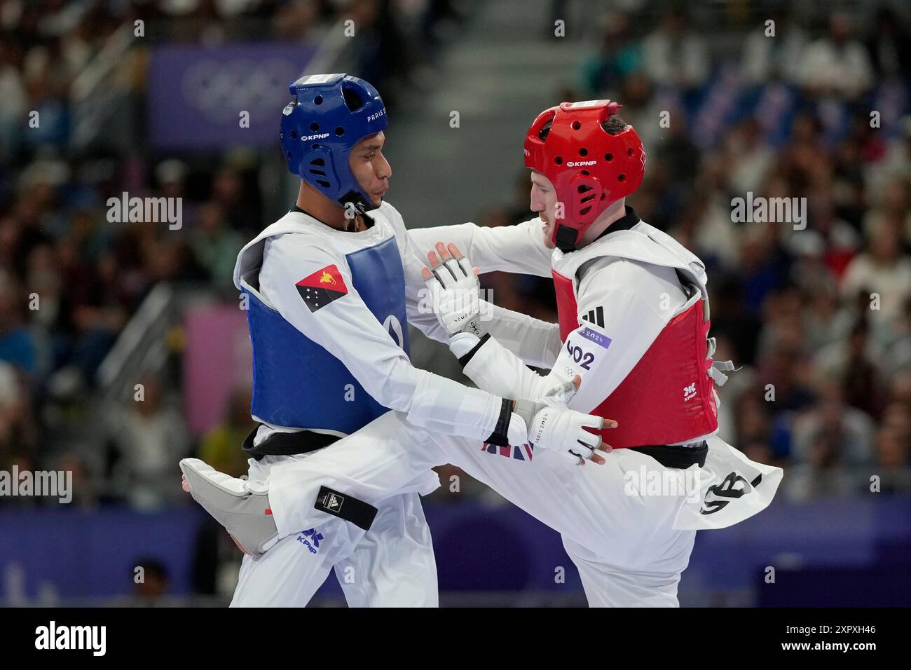 Papua New Guinea's Kevin Sogo Kassman competes with Britain's Bradly ...