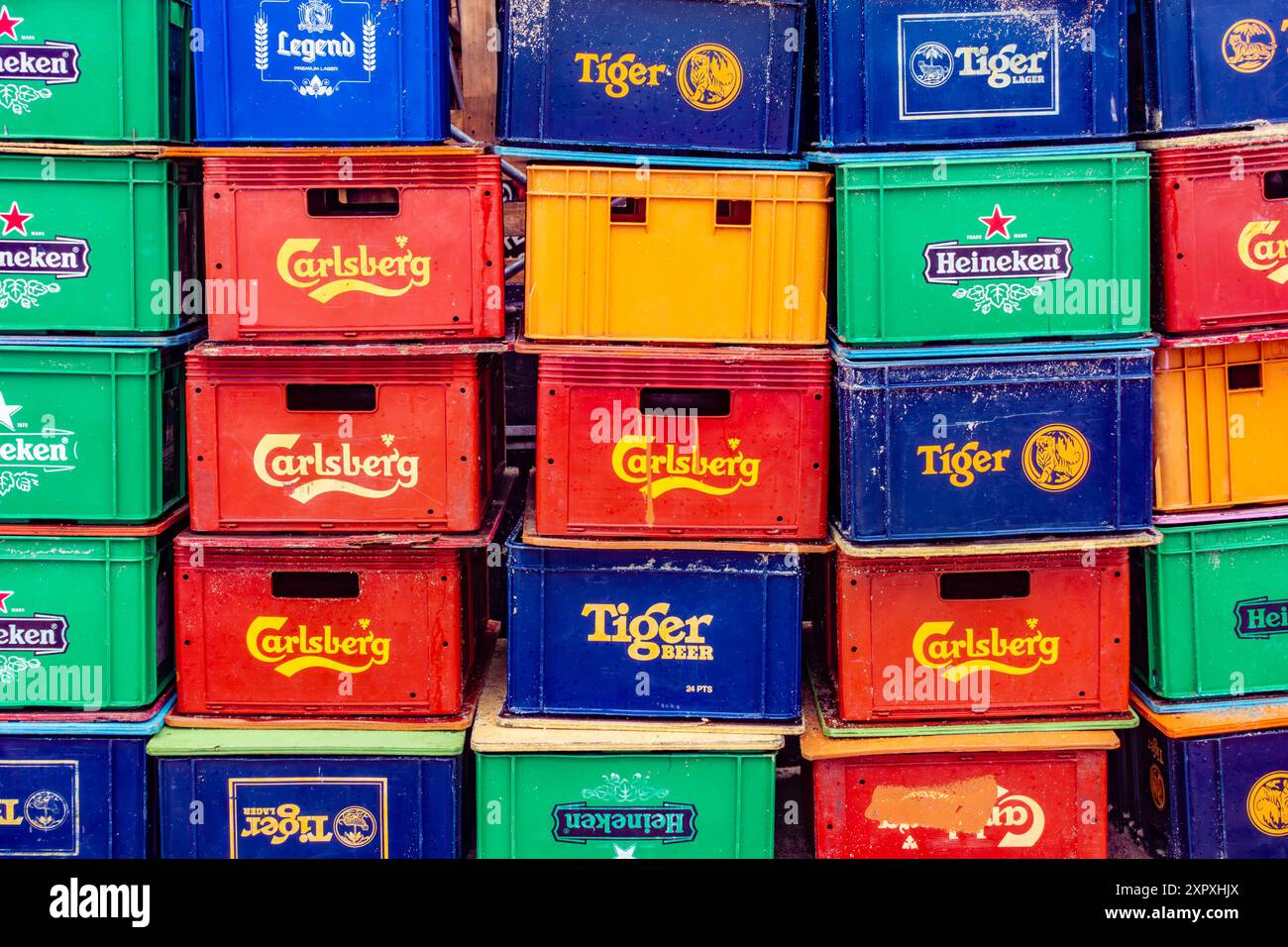 Colourful plastic beer crates stacked together Stock Photo - Alamy