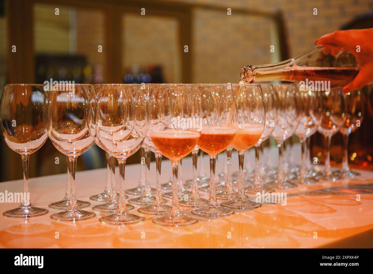 Elegant Evening of Pouring Rose Wine Into Crystal Glasses at Tasting ...