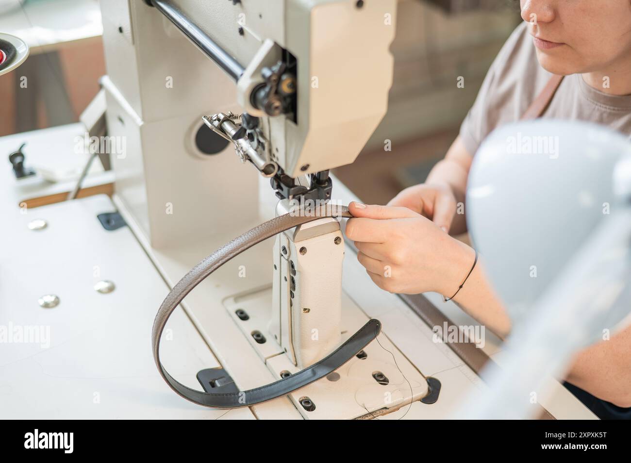 Woman tanner sews leather hi-res stock photography and images - Alamy