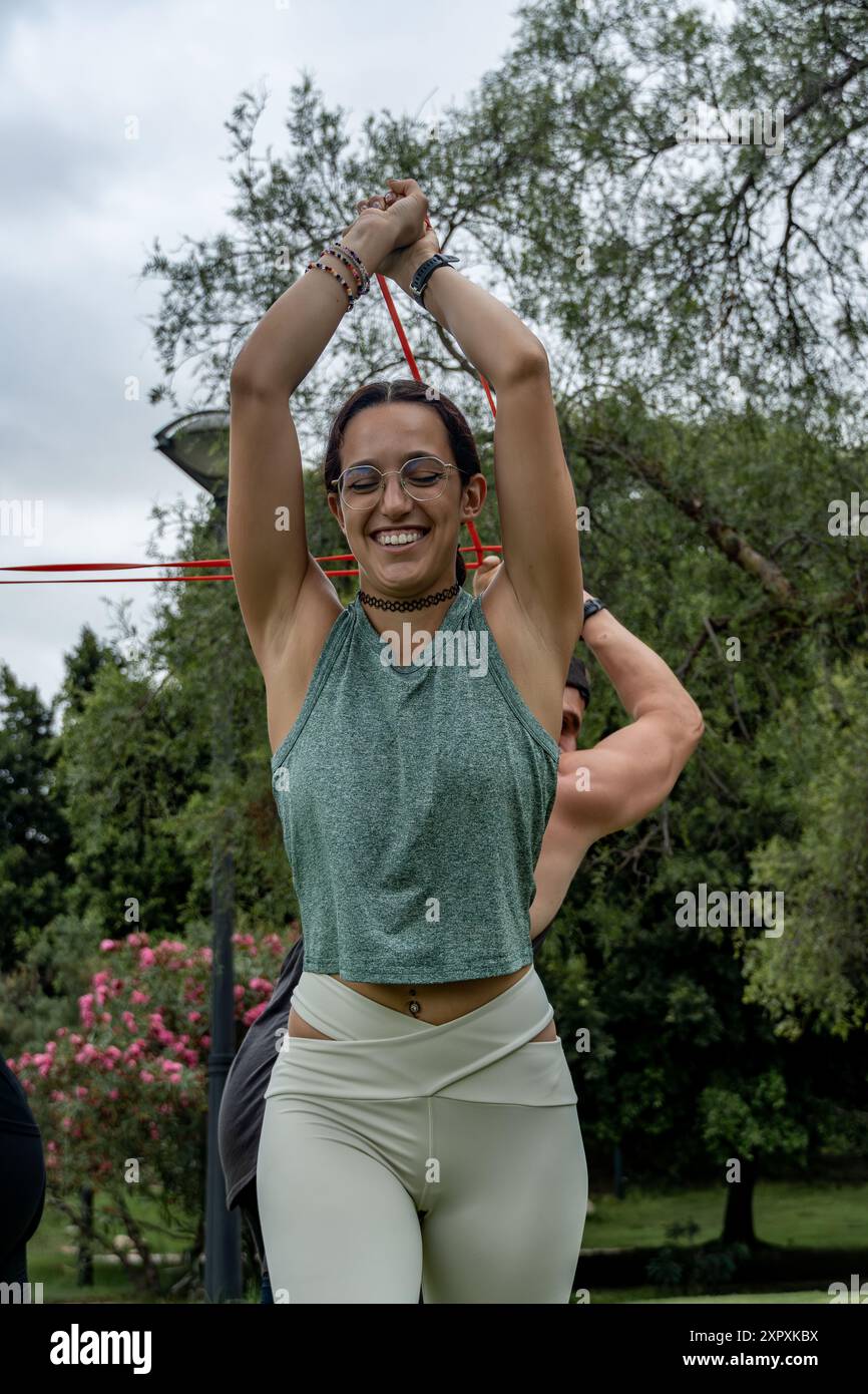 Young woman exercises outdoors using hi-res stock photography and ...