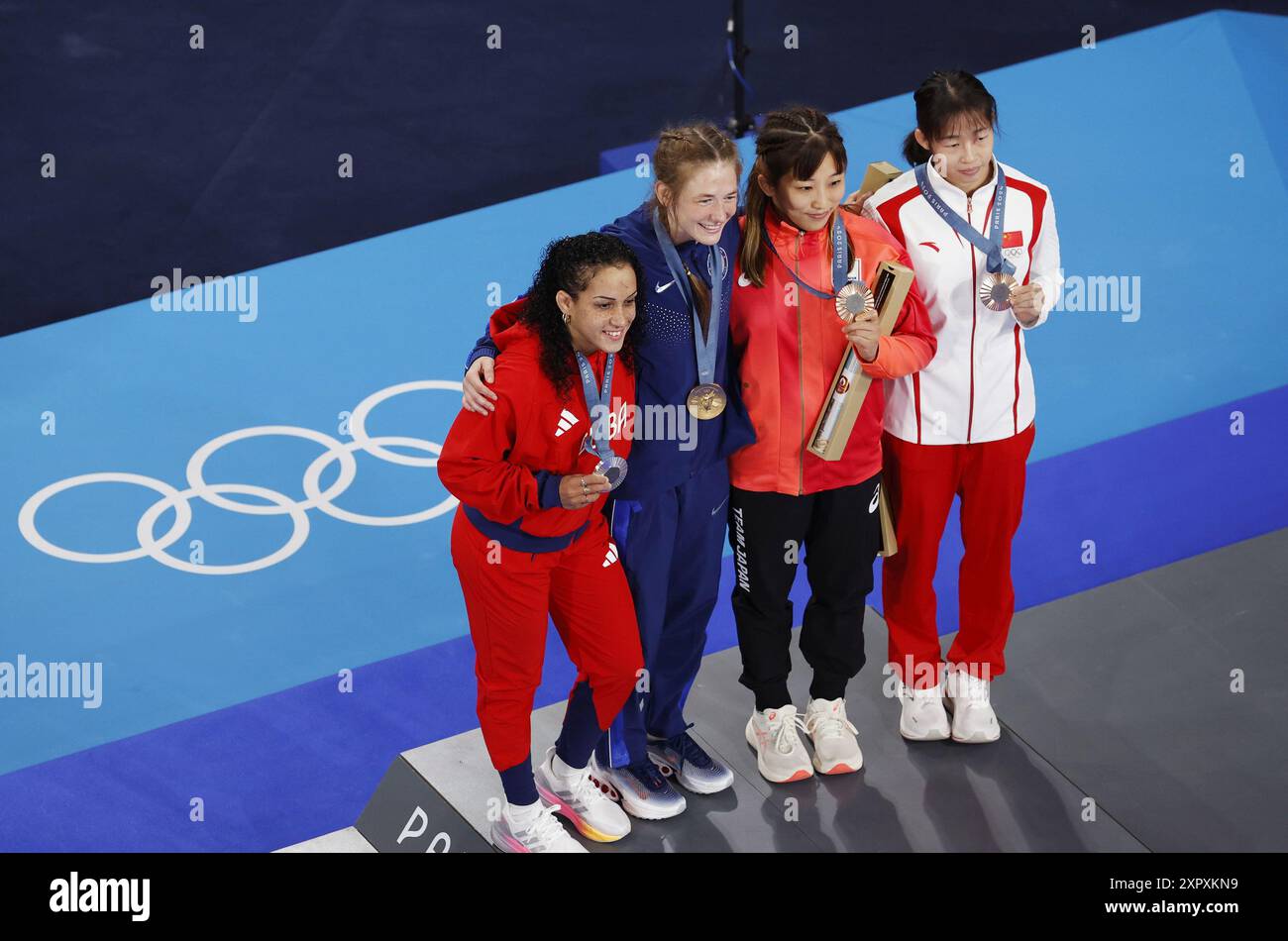 Sarah Hildebrandt (2nd from L) of the United States poses at the medal ...