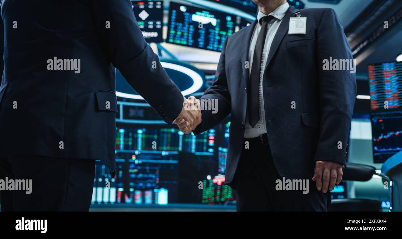 Two Anonymous Stock Market Traders Shaking Hands in a Technologically ...