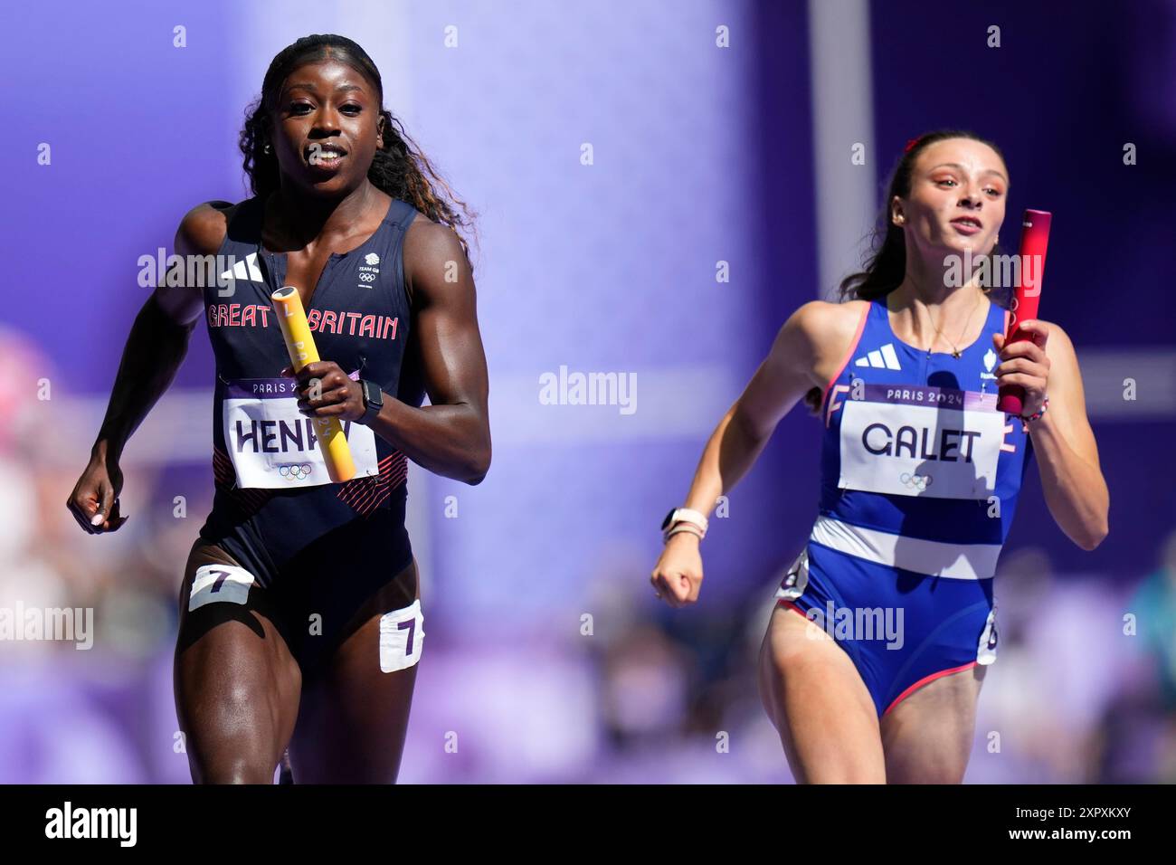 Desiree Henry, of Britain, and Chloe Galet, right, of France, run in ...