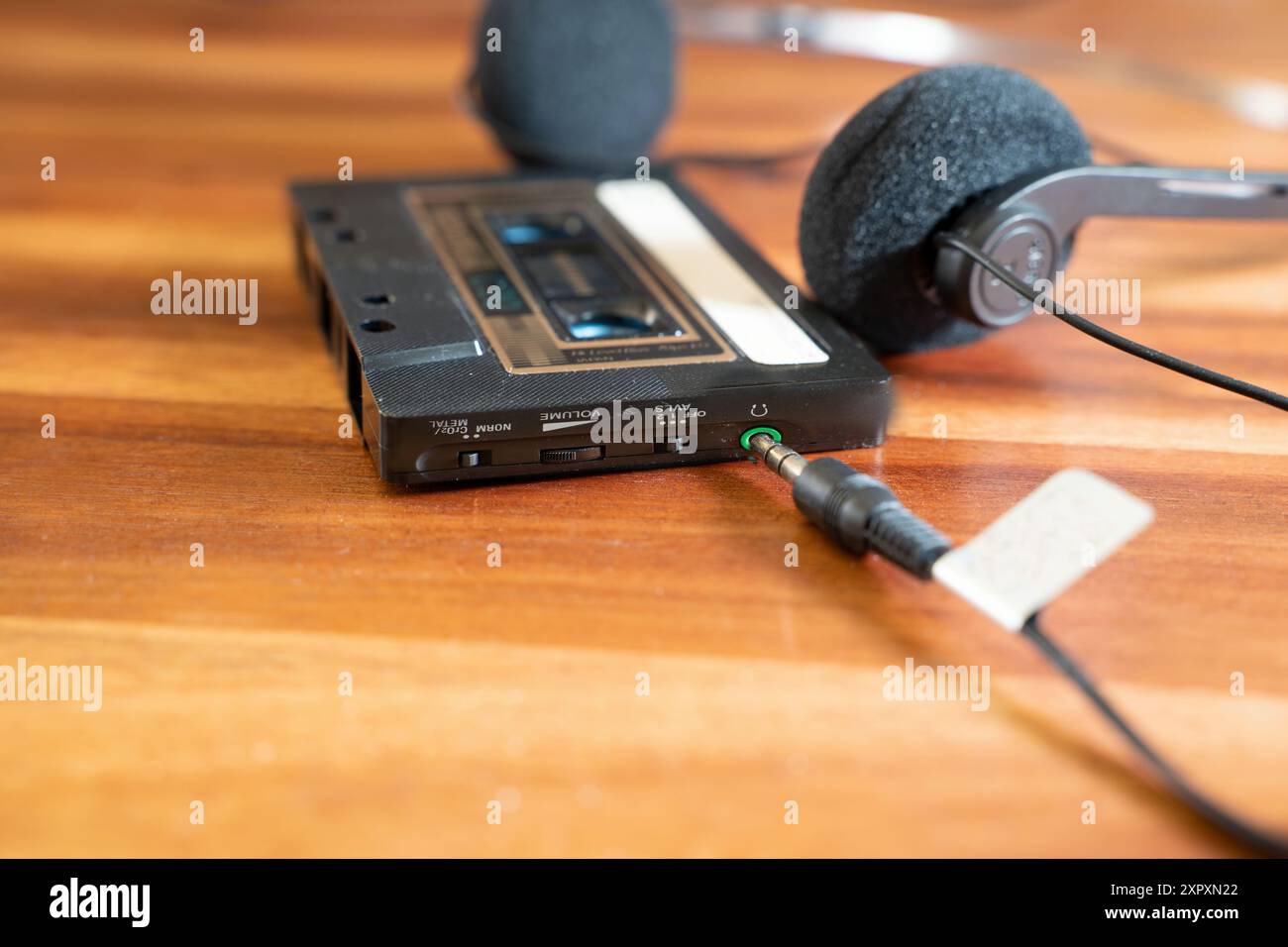 Music cassette with integrated volume control and headphone jack ...