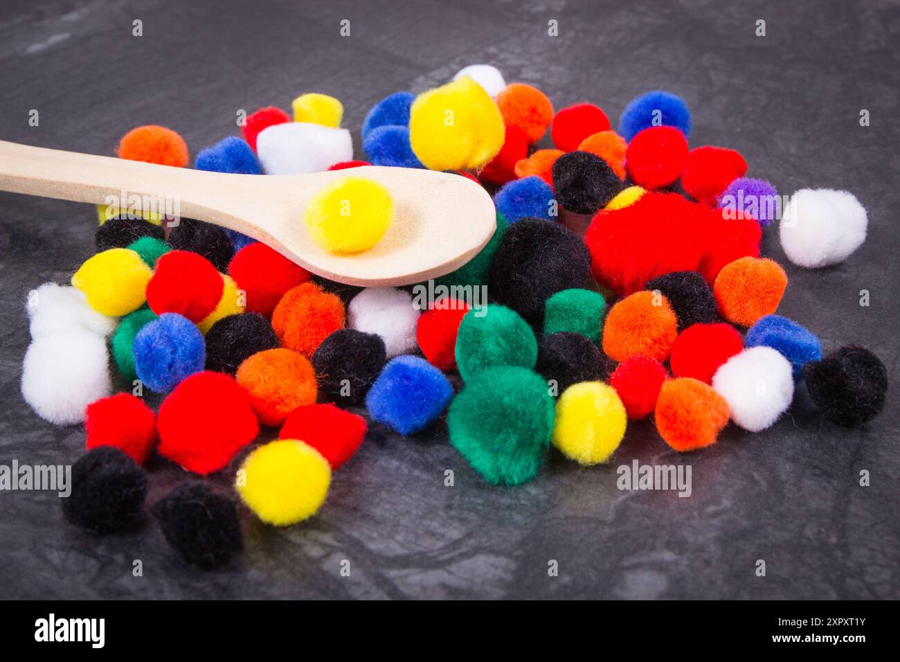Small colorful pompoms using for development of kids motor skills ...