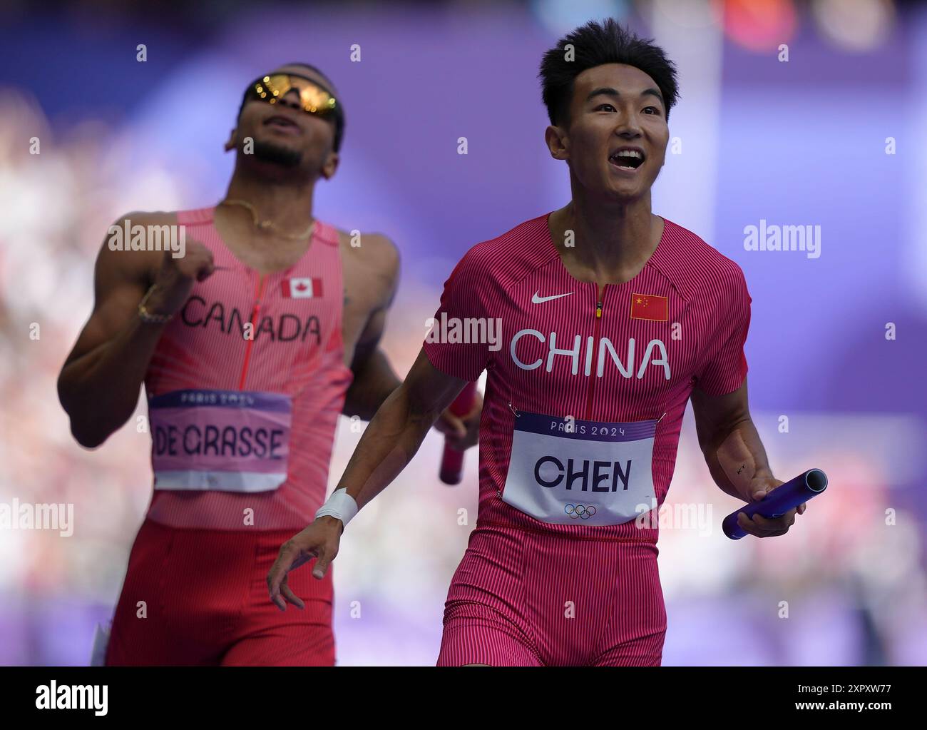 Paris, France. 8th Aug, 2024. Chen Jiapeng (R) of team China reacts after the men's 4X100m relay ...
