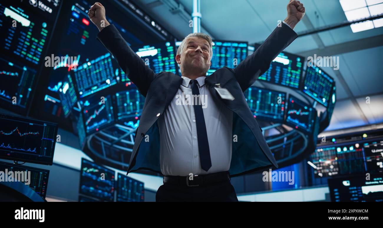 Stock Market Day Trader Working at an Exchange Office with Multi ...