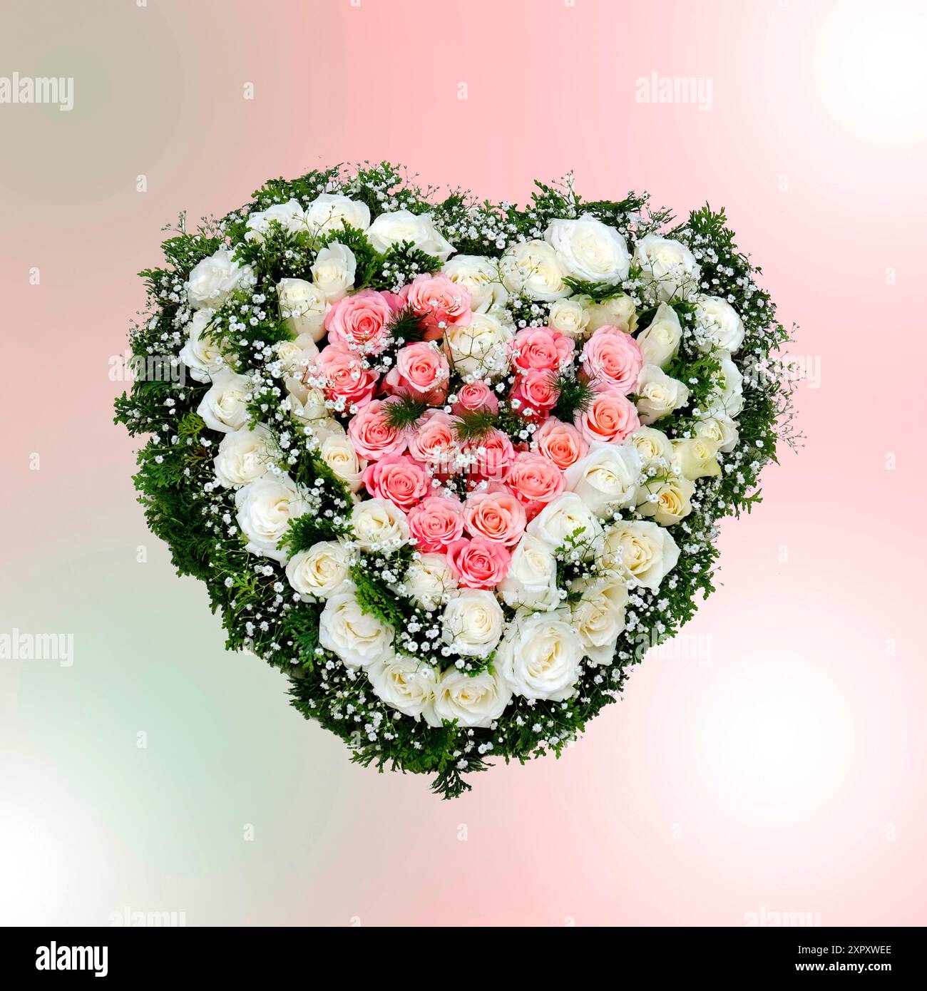 Heart made of pink and white roses for a funeral service, Composing ...