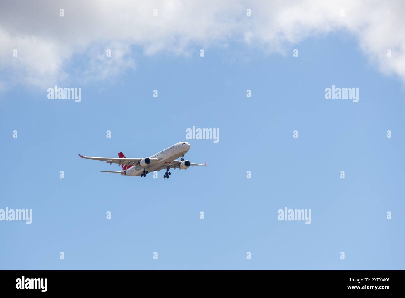 Turkish airlines airbus a330 is flying through a beautiful blue sky ...