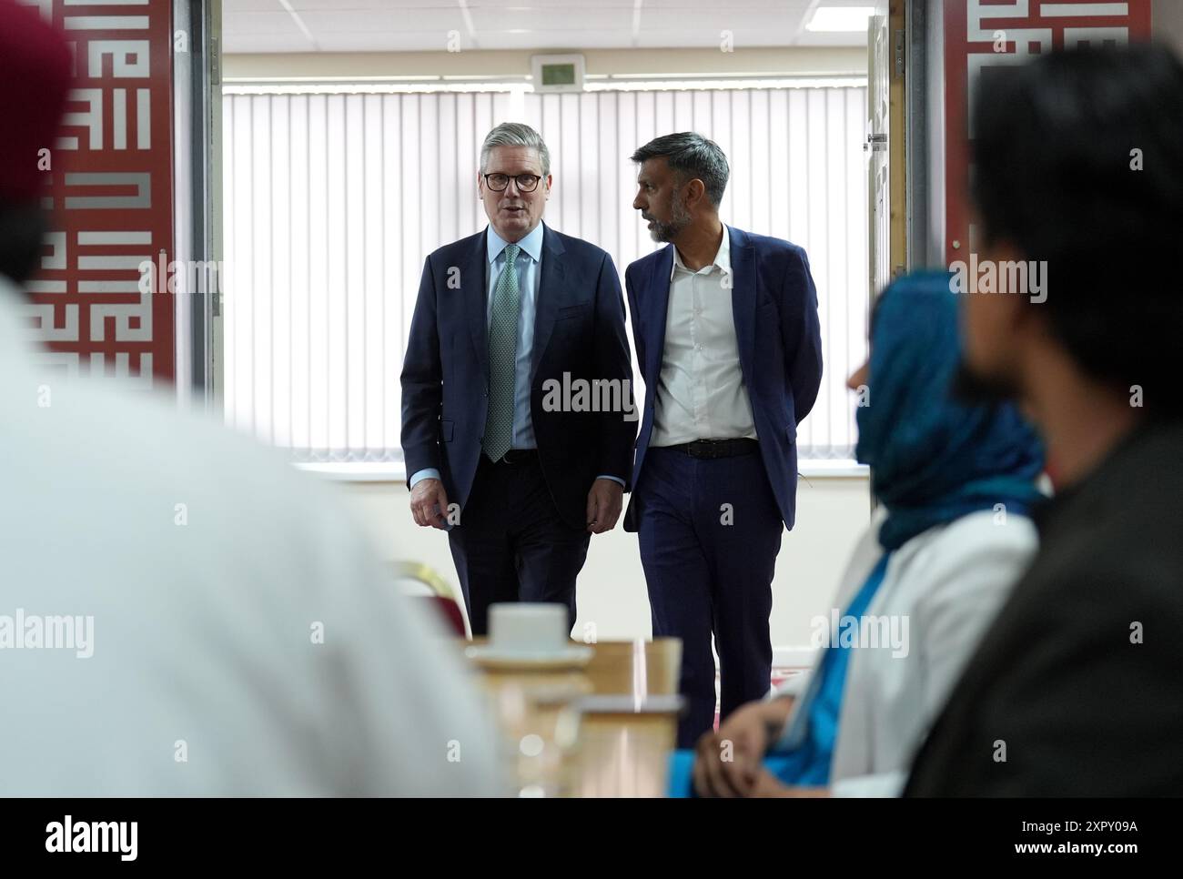 Prime Minister Sir Keir Starmer (left) with Jehangir Malik, member of ...