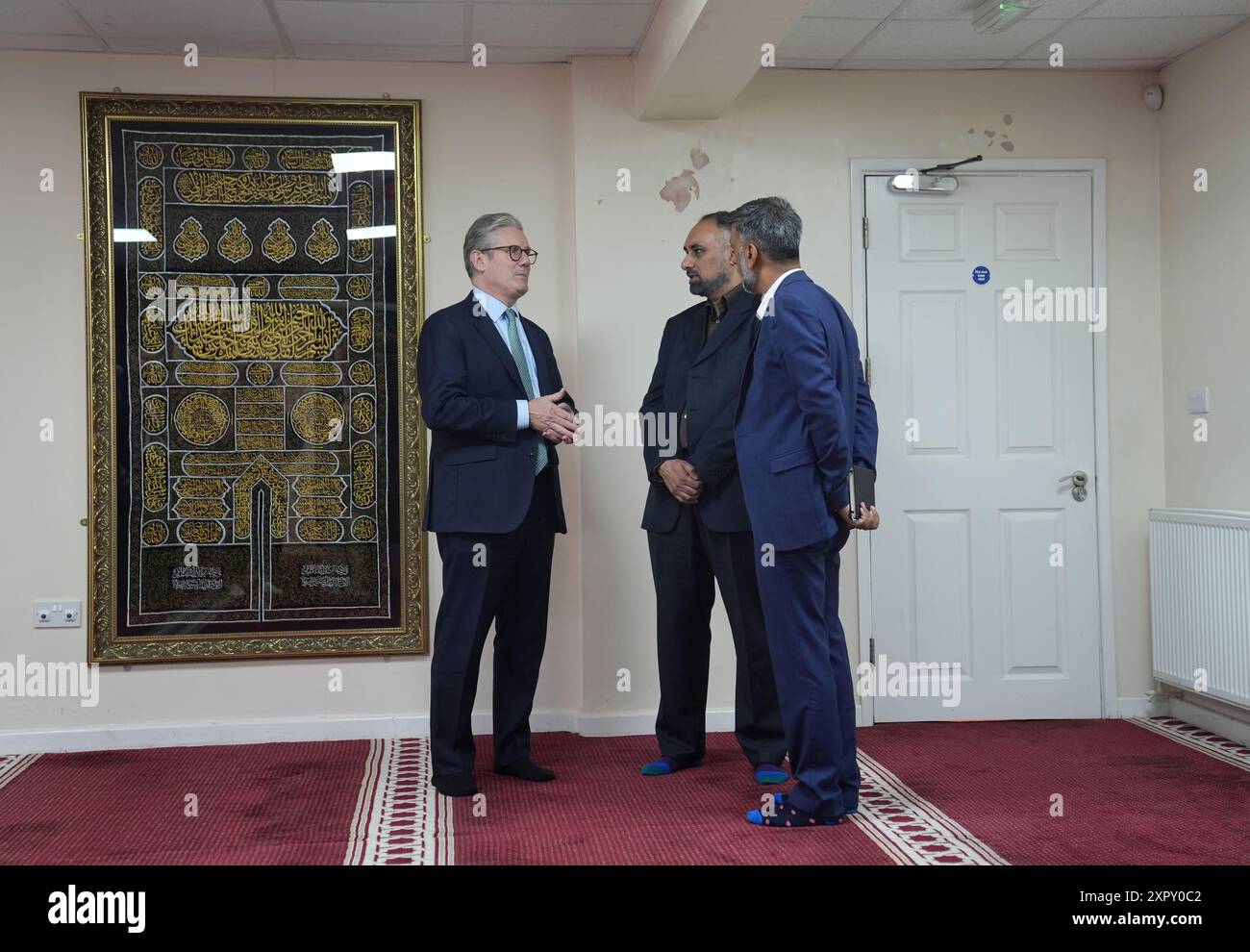 Prime Minister Sir Keir Starmer (left) with Jehangir Malik (right ...