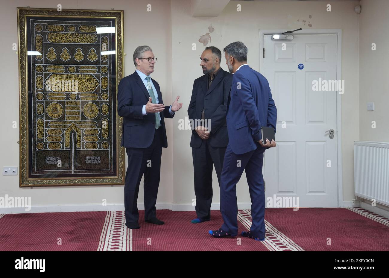 Prime Minister Sir Keir Starmer (left) with Jehangir Malik (right ...