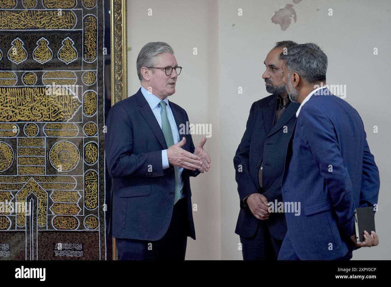 Prime Minister Sir Keir Starmer (left) with Jehangir Malik (right ...