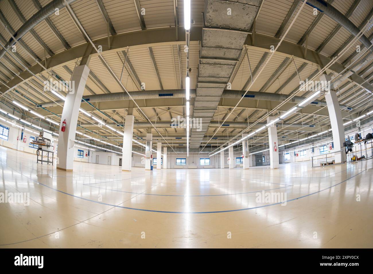 Closed down empty factory interior manufacturing hall with tall ceiling ...