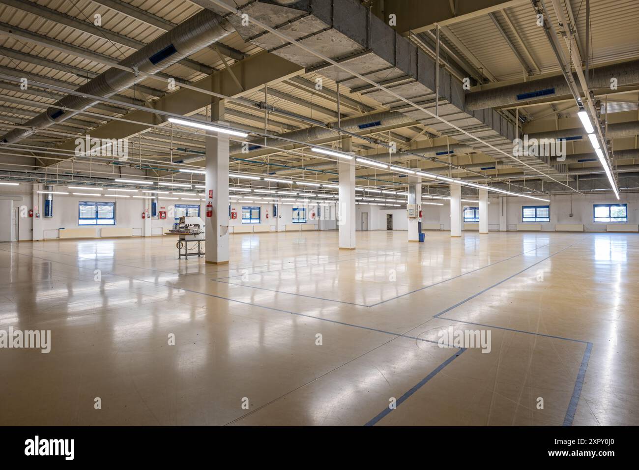 Closed down empty factory interior manufacturing hall with tall ceiling ...