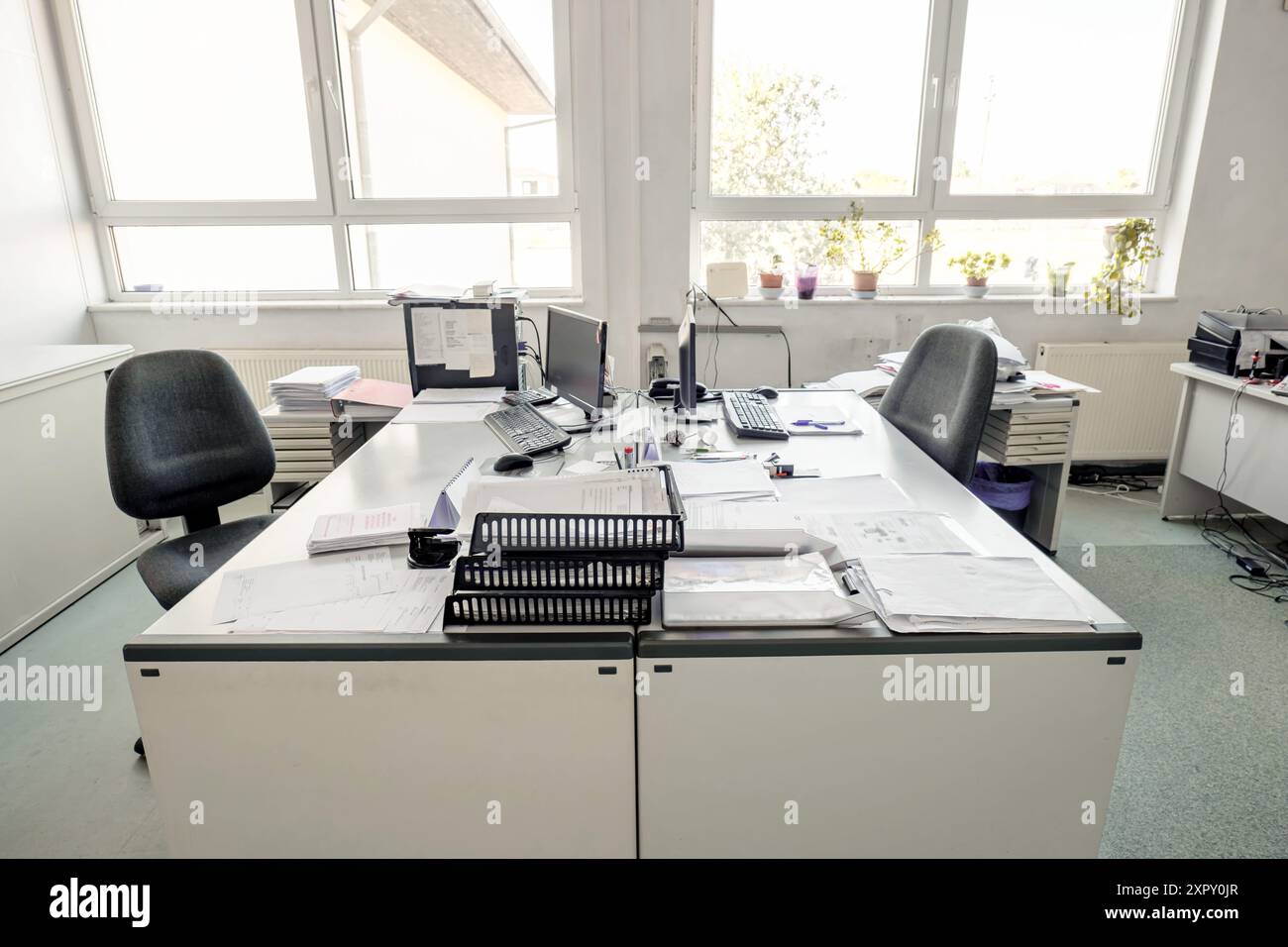 Messy office room of a closed down factory, no people Stock Photo - Alamy