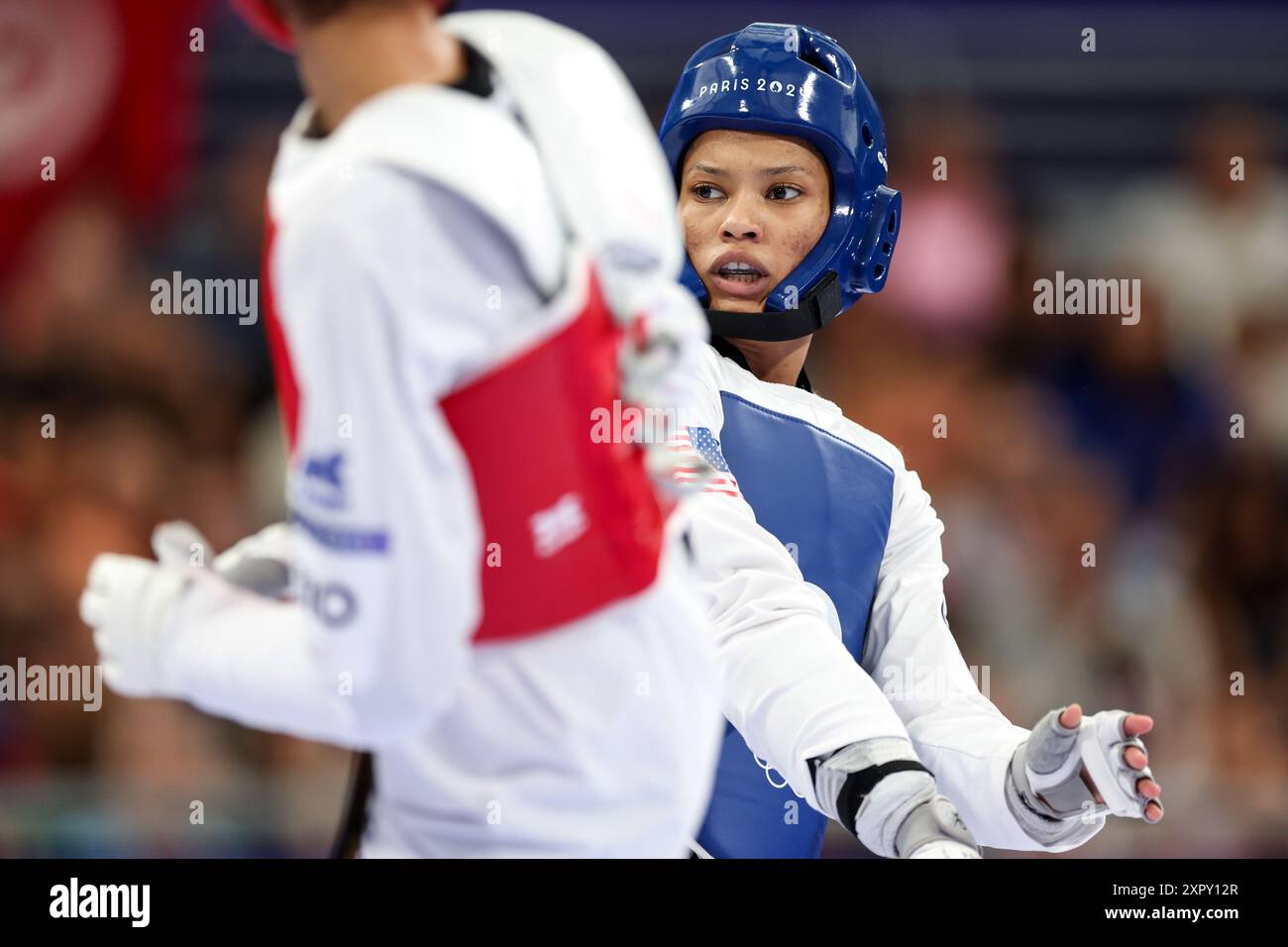 Faith Dillon of USA (blue) competes against Chaima Toumi of Tunisia ...
