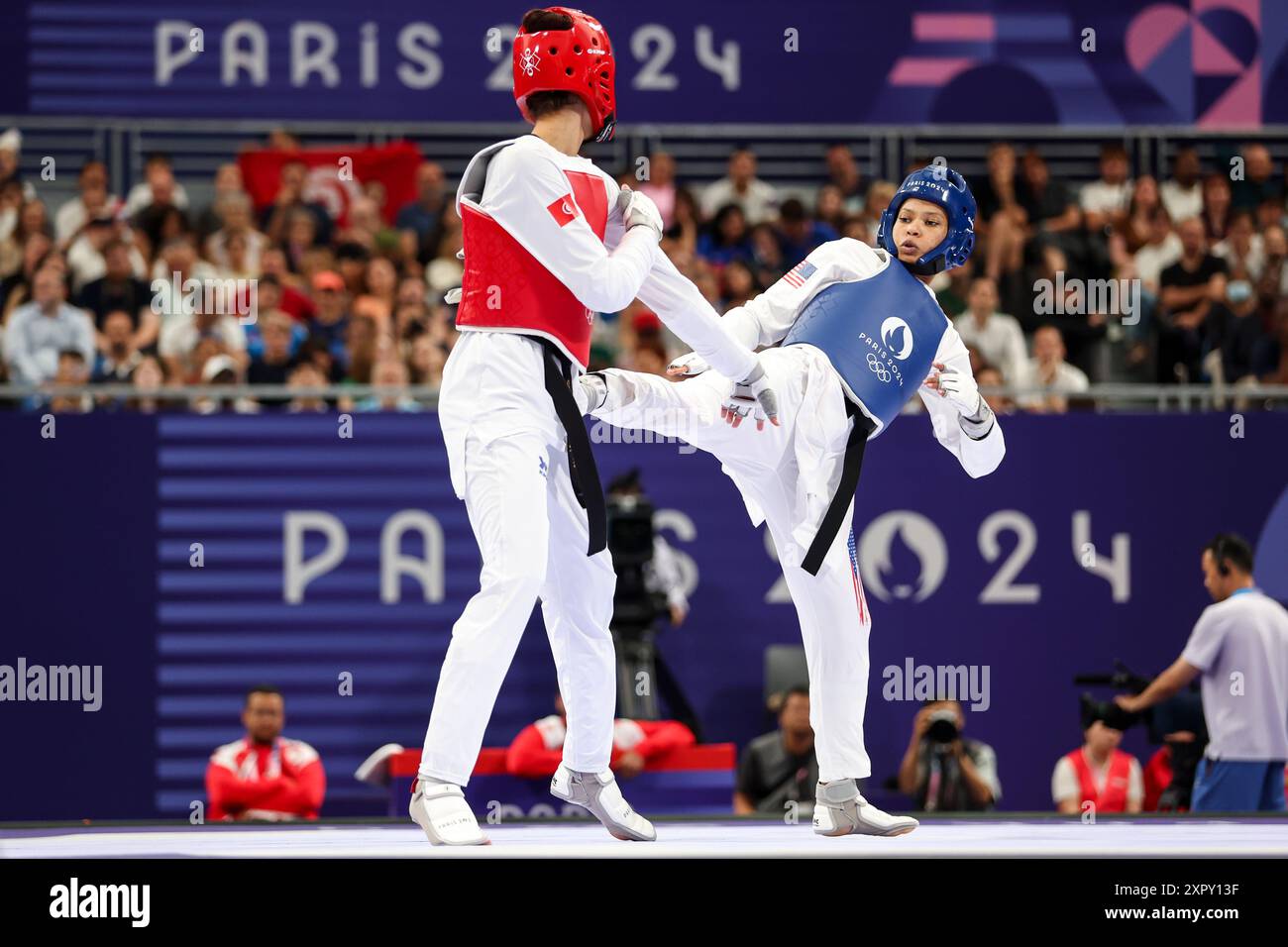 Faith Dillon of USA (blue) and Chaima Toumi of Tunisia (red) compete ...