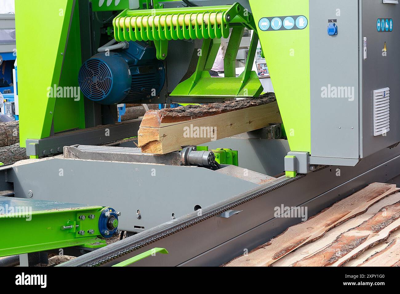 The process of sawing wood on sawmill equipment. Timber industry Stock ...