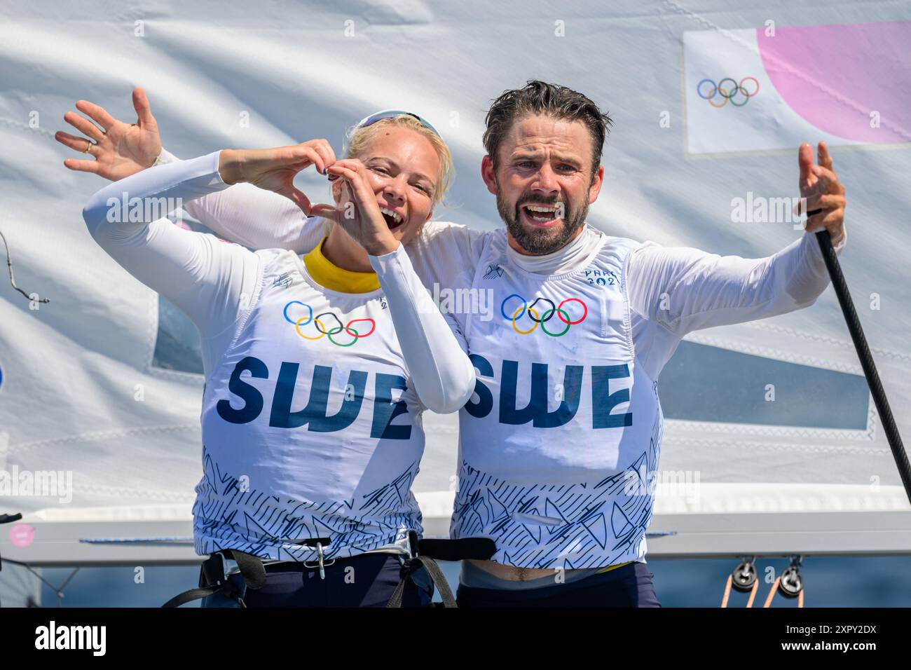 Anton Dahlberg and Lovisa Karlsson of, Sweden. , . celebrate after mixed dinghy - 470 sailing ...