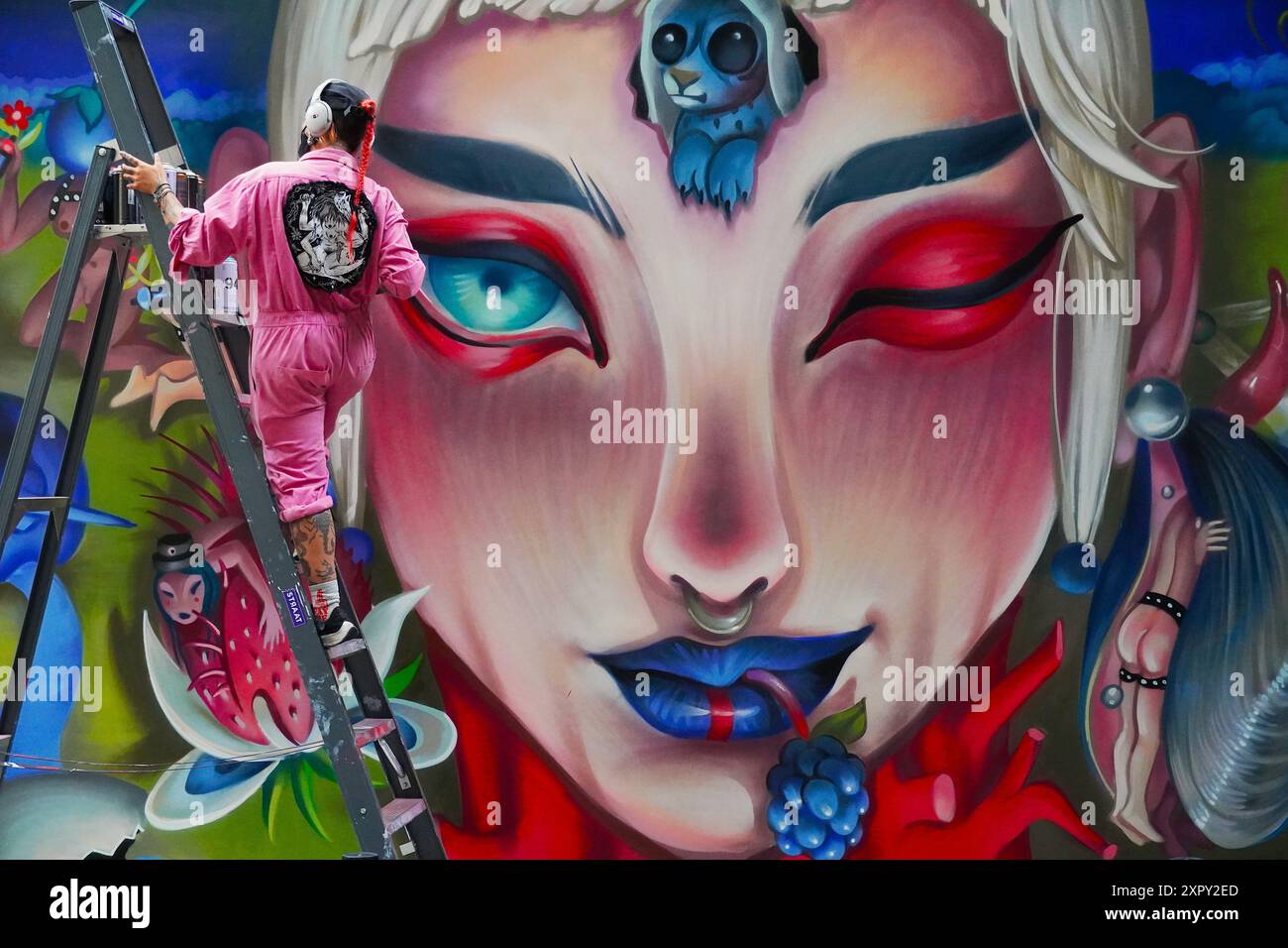 Graffiti artist creating mural at STRAAT: the museum for street art and ...