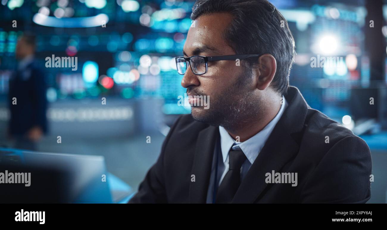 Portrait of a Young Indian Man Working in an International Stock ...