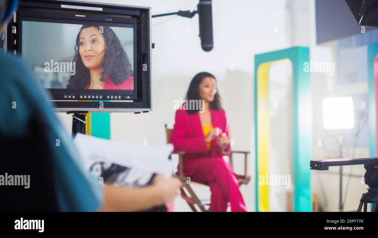 Vibrant On-set Image Of A Young Black Female Host In A Pink Suit ...