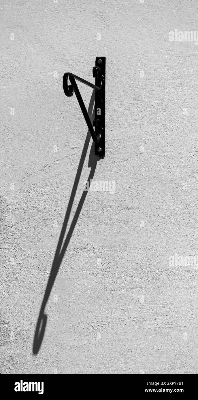 wall bracket with strong diagonal shadow Stock Photo - Alamy