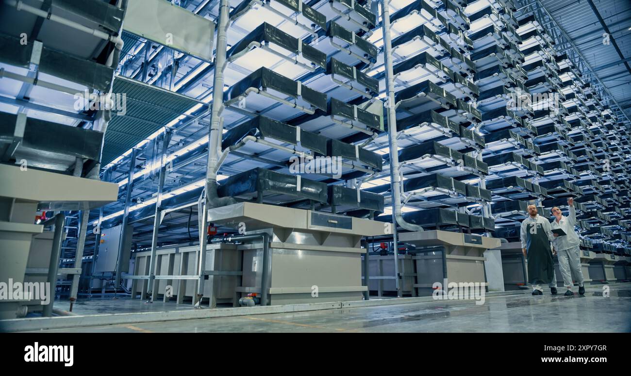 Vertical Farm Operators Having a Conversation at Work while Walking in ...