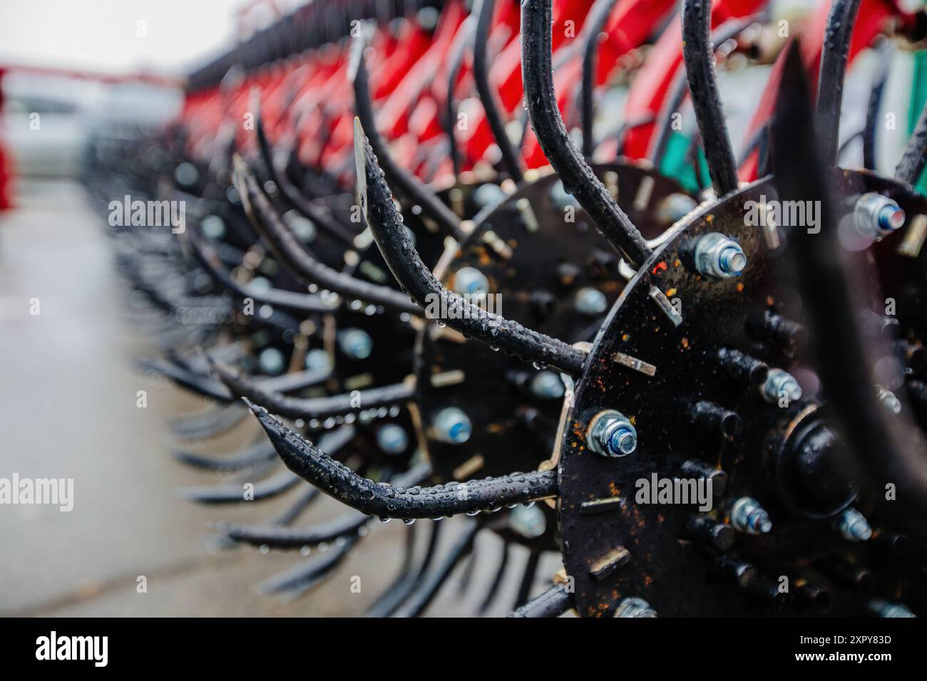 Working parts of modern rotary tooth harrow, close up Stock Photo - Alamy