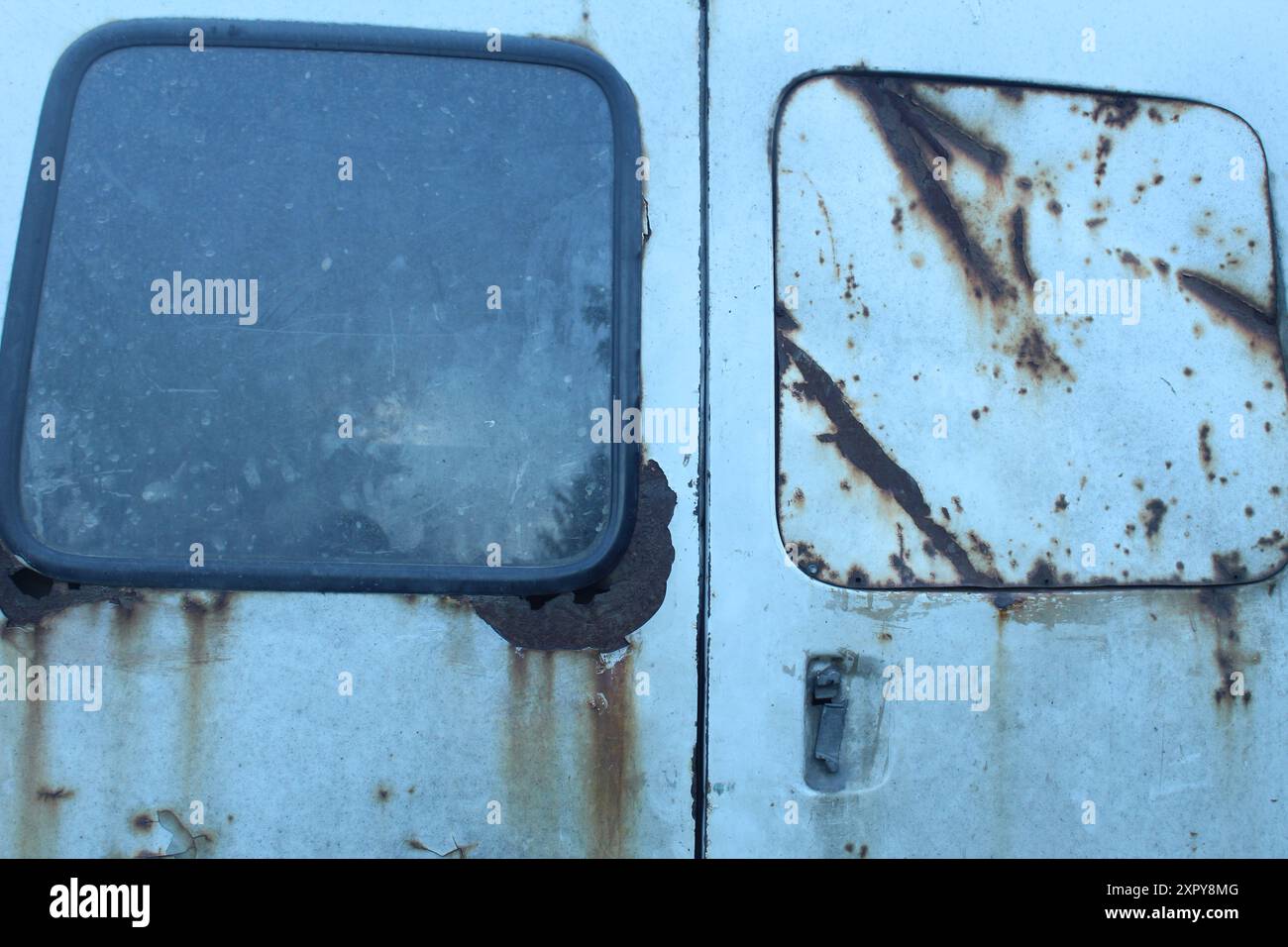 Rusty Car Doors. Rear doors of an old car Stock Photo - Alamy