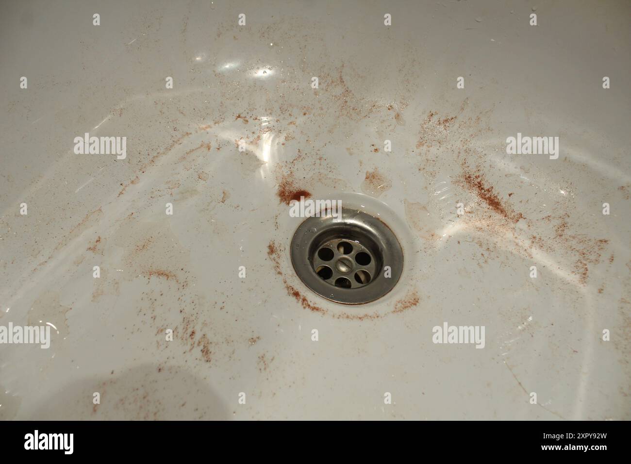 dirty drain. Traces of dirt rust near the water drain in the bathtub ...