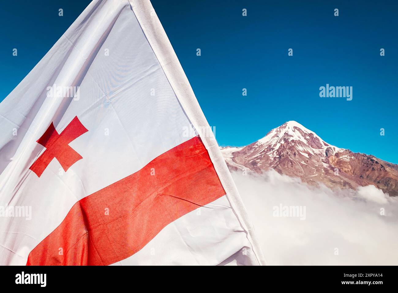 Close up georgian flag banner with caucasus mountains Kazbek peak ...
